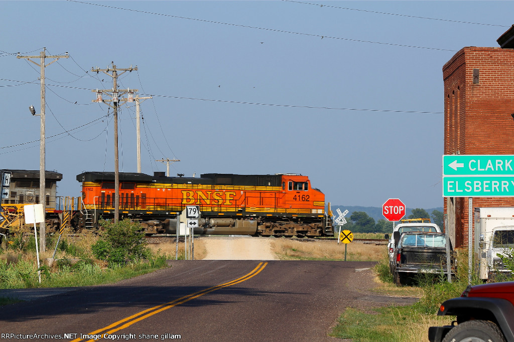 BNSF 4162 heads thur small town usa.
